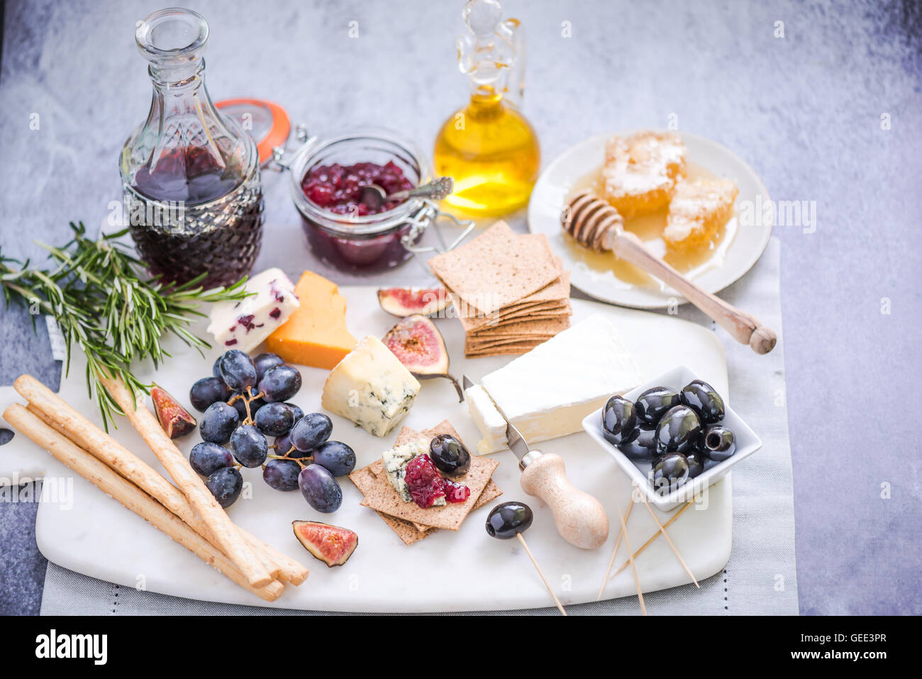 italian cheese selection with olives,grapes and fig Stock Photo - Alamy