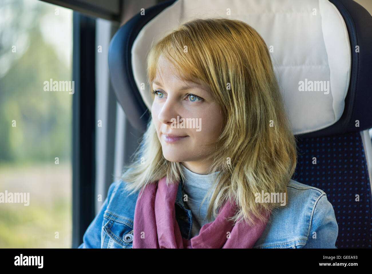 Woman traveler in train Stock Photo - Alamy