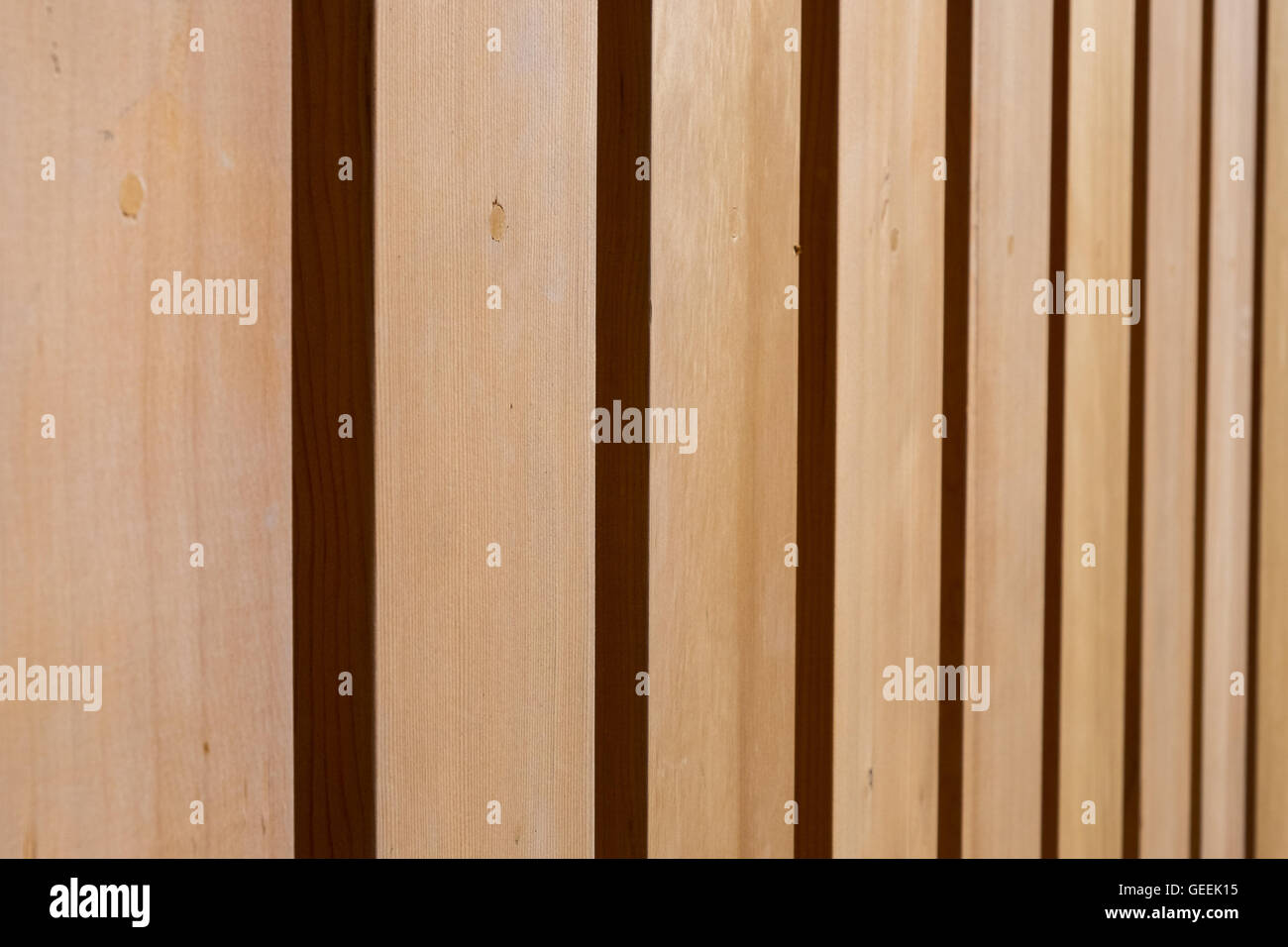 Receding vertical pattern in wood wall, light and dark stripes ...