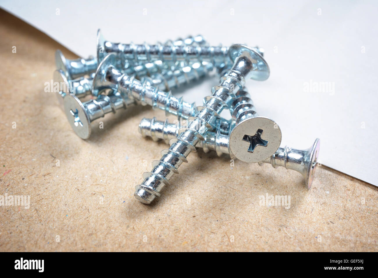 heap of screws on recycled paper Stock Photo - Alamy