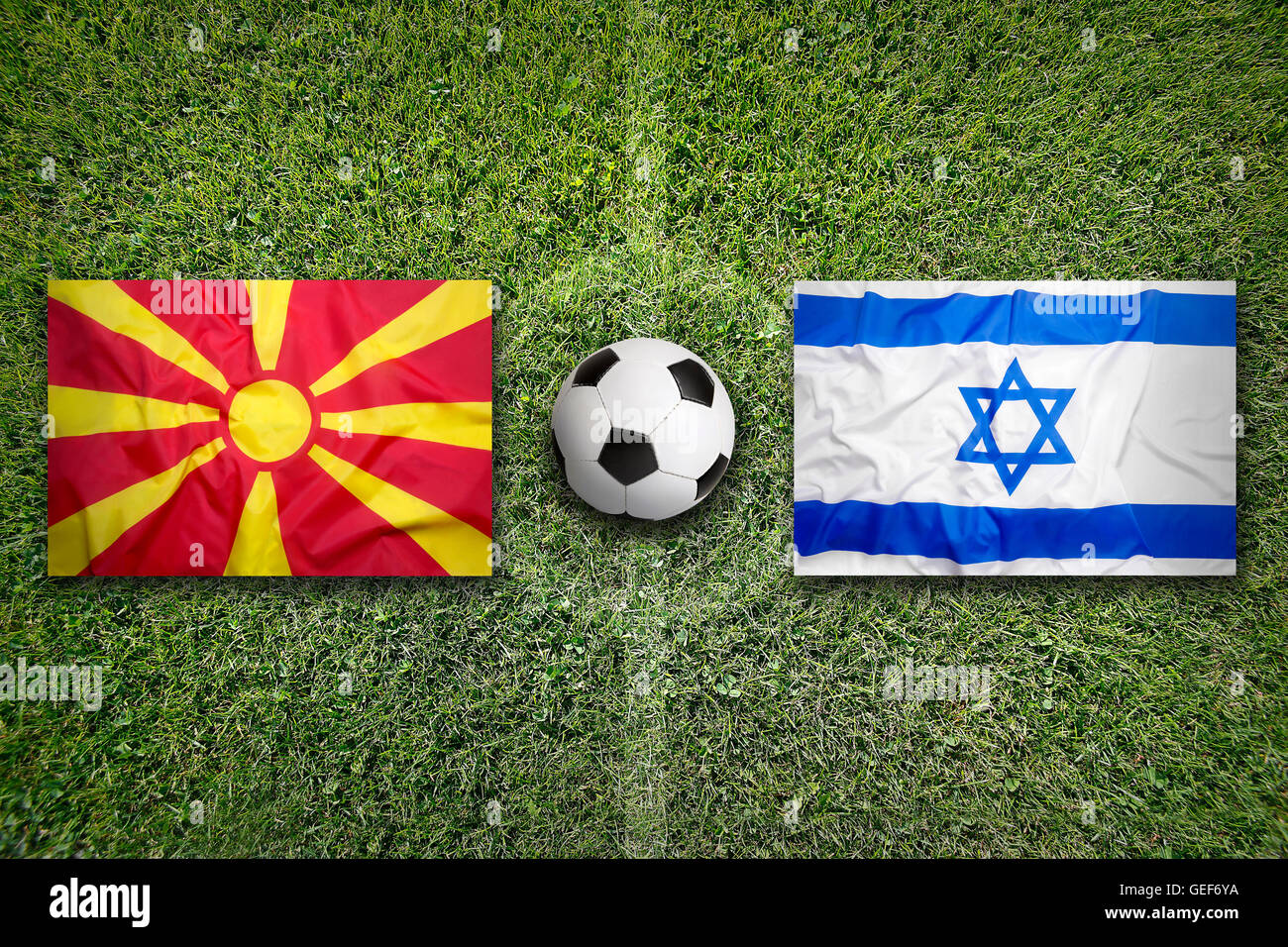 Macedonia vs. Israel flags on green soccer field Stock Photo - Alamy
