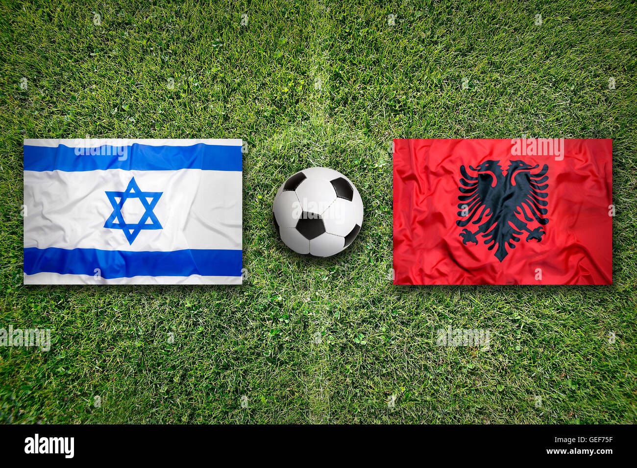Israel vs. Albania flags on green soccer field Stock Photo - Alamy