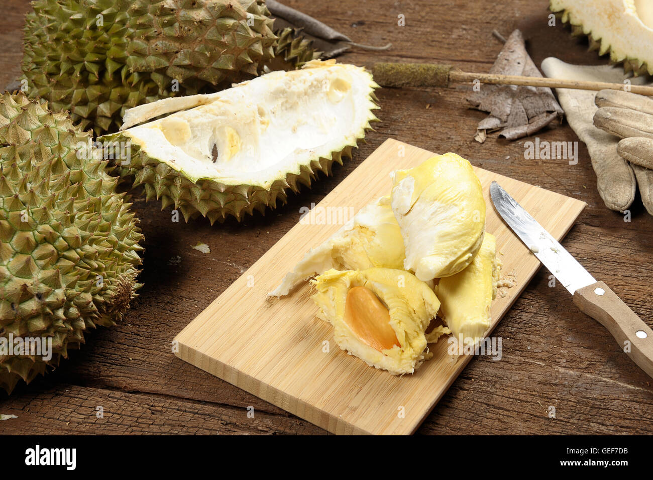 peeling Thai durian on wooden table Stock Photo - Alamy