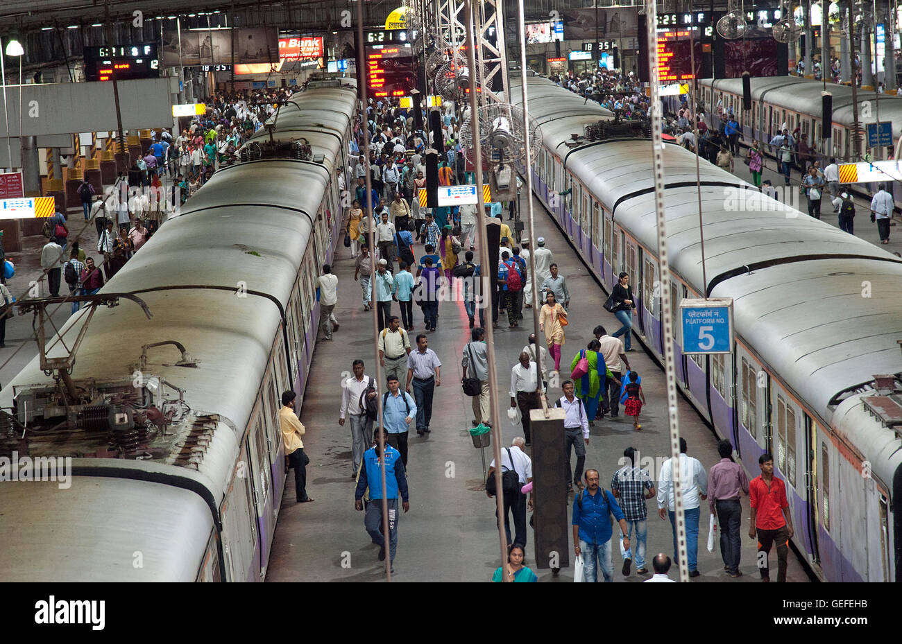 The image of Local train and commuters at CST station building or VT ...