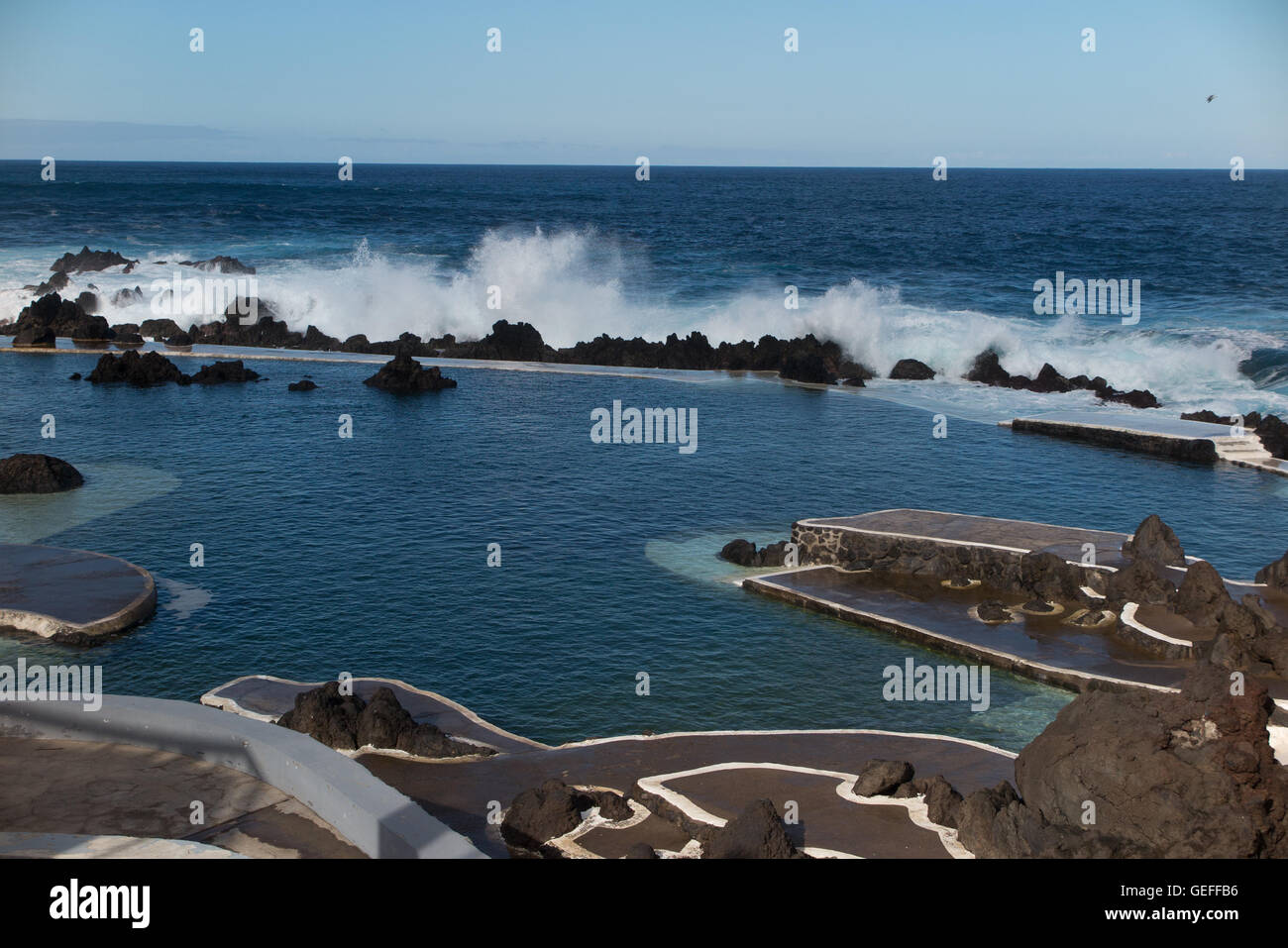 Natural salt water swimming pool formed in the volcanic rocks at Porto ...