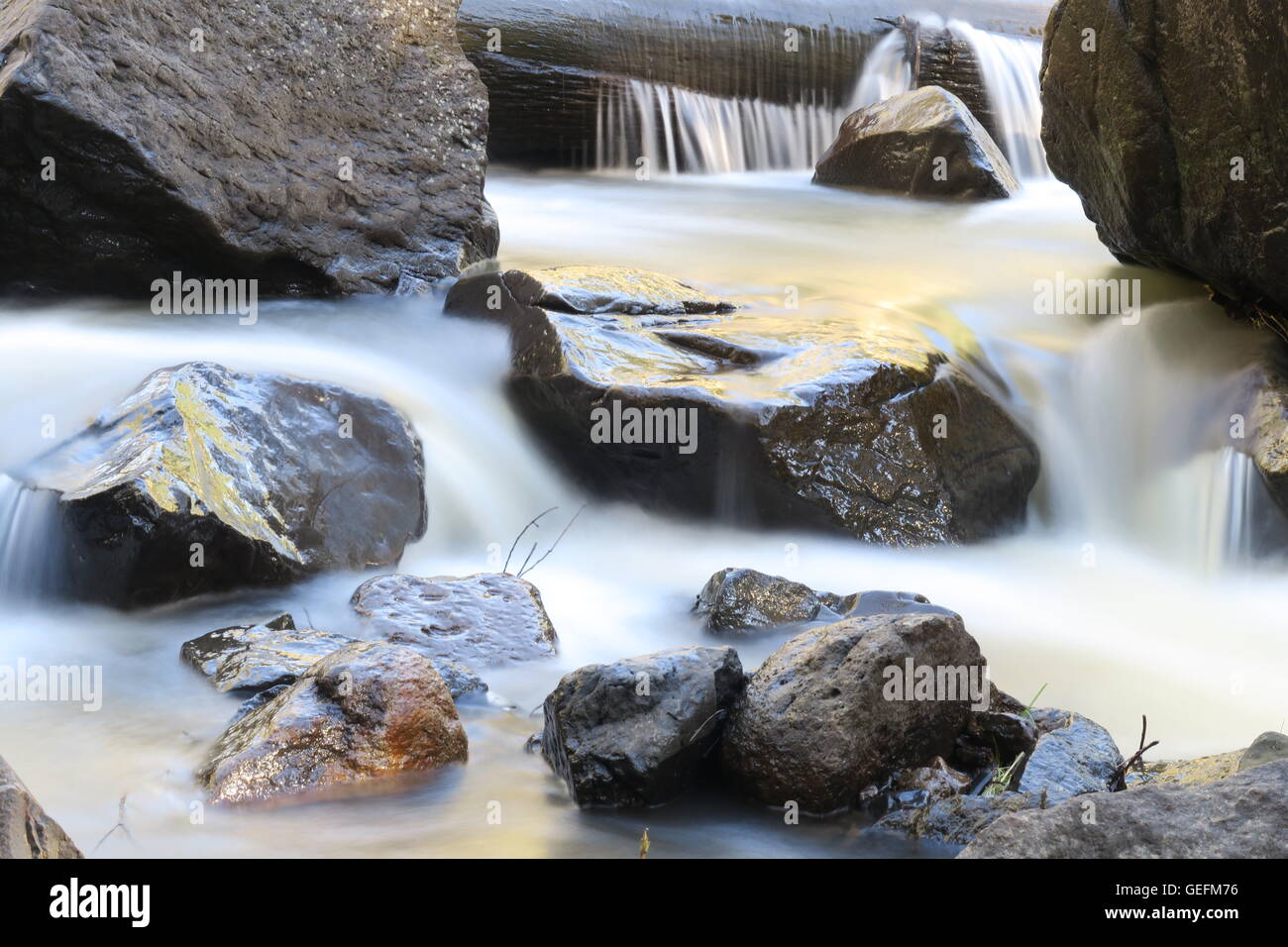 Water Flowing Over Rocks Stock Photo - Alamy