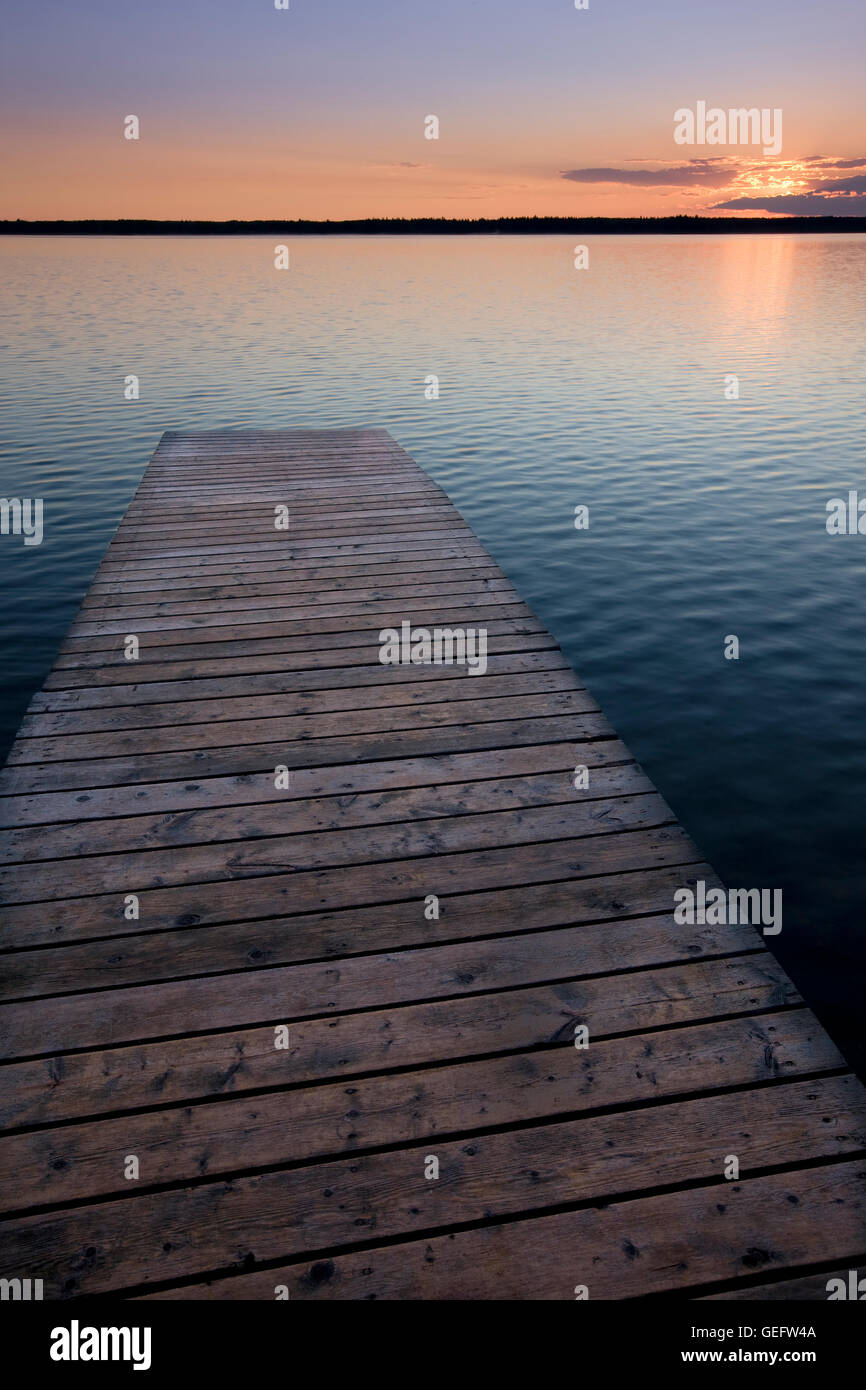 geography,travel,Canada,Manitoba,Wasagaming,Sunset over a wooden wharf ...