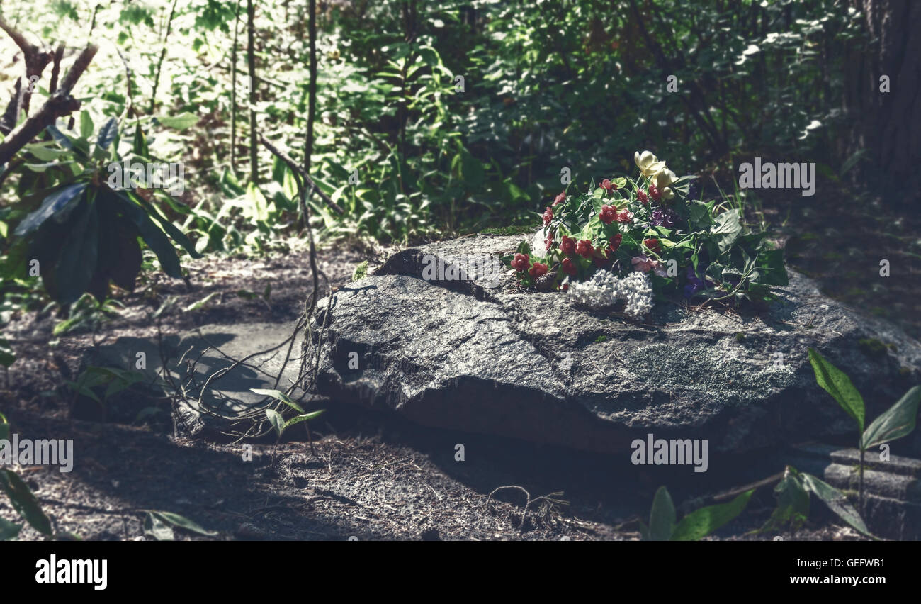 Big dark grey tombstone at sunny summer day Stock Photo - Alamy