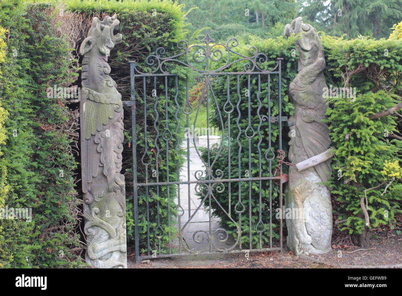 Decorative stone gatepost and gate Stock Photo - Alamy