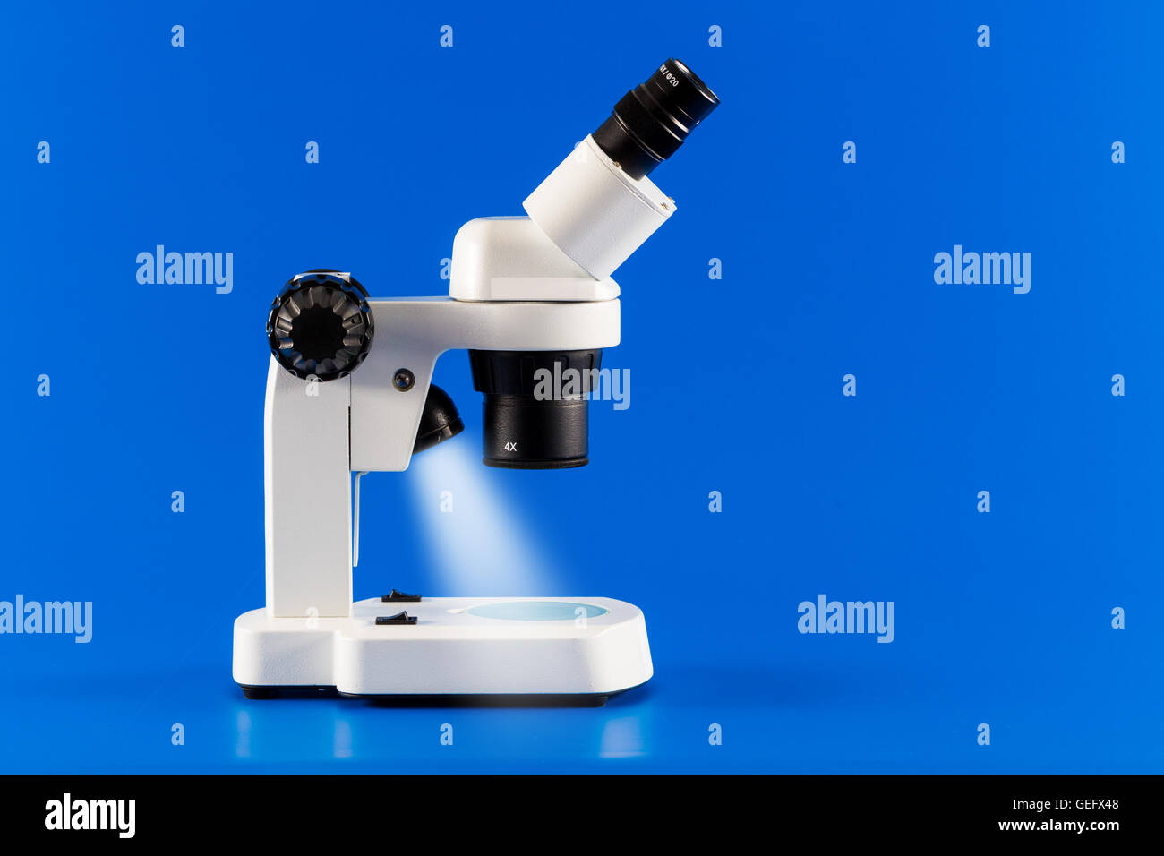 Binocular microscope on blue background hi-res stock photography and ...