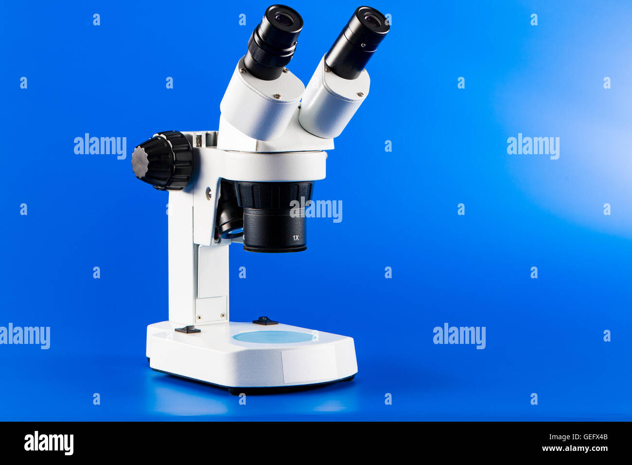 Binocular microscope on blue background hi-res stock photography and ...