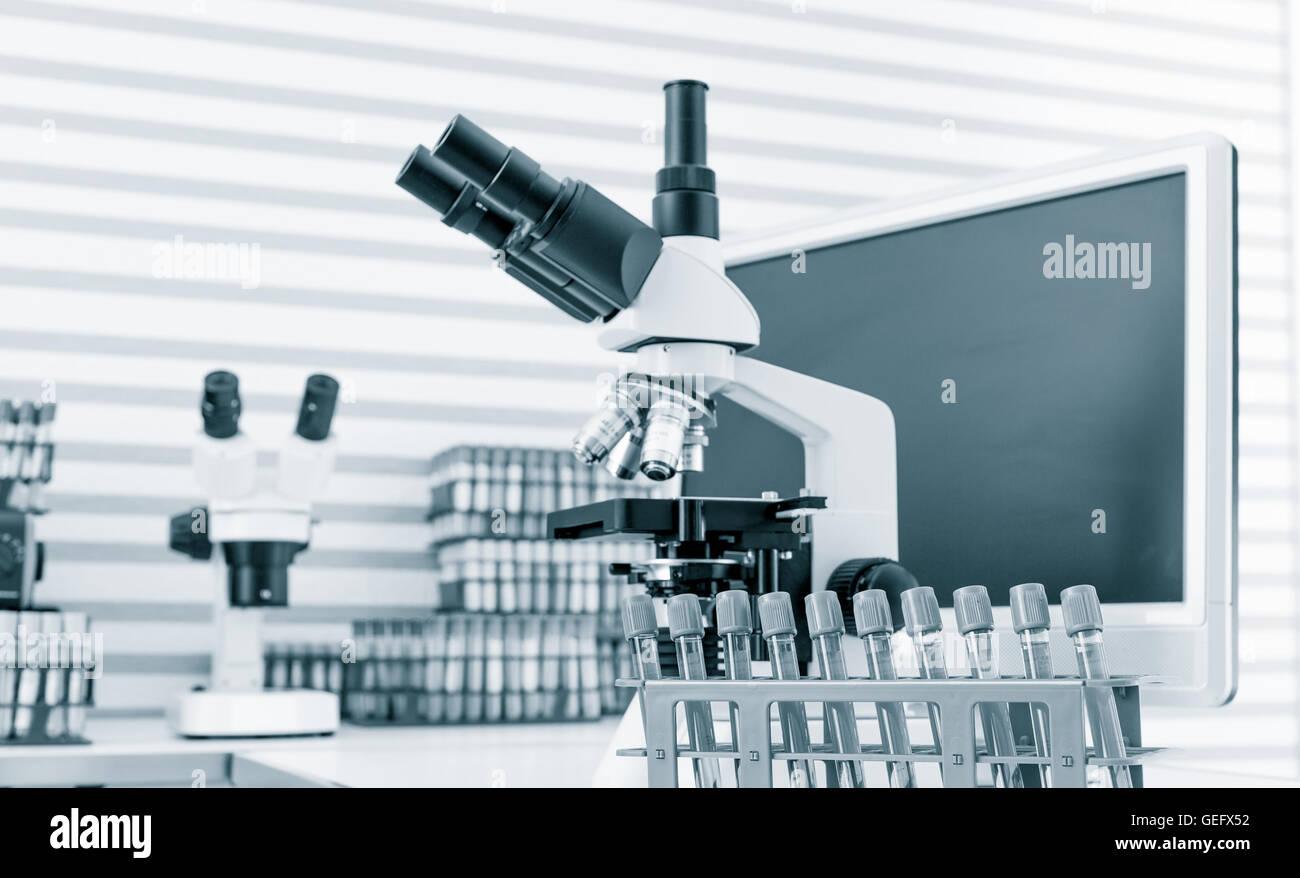 liquid in the test tubes in laboratory with microscope Stock Photo - Alamy