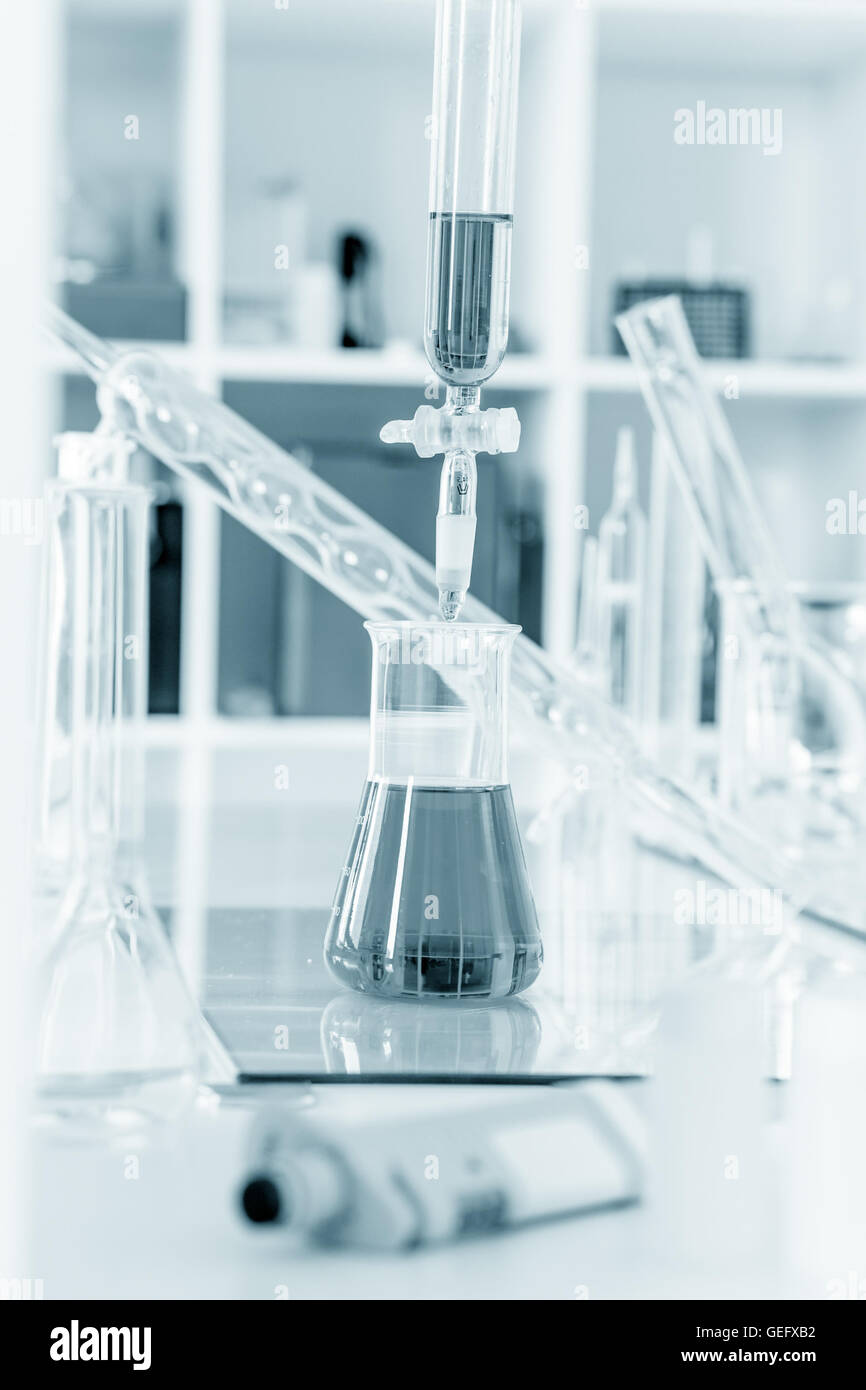 pipette and chemical glass in laboratory blue color Stock Photo - Alamy