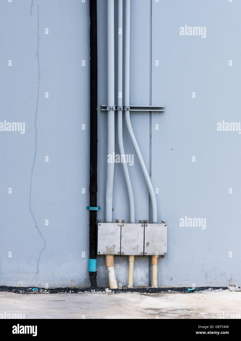 Group of the electrical control box on the outside of factory wall ...