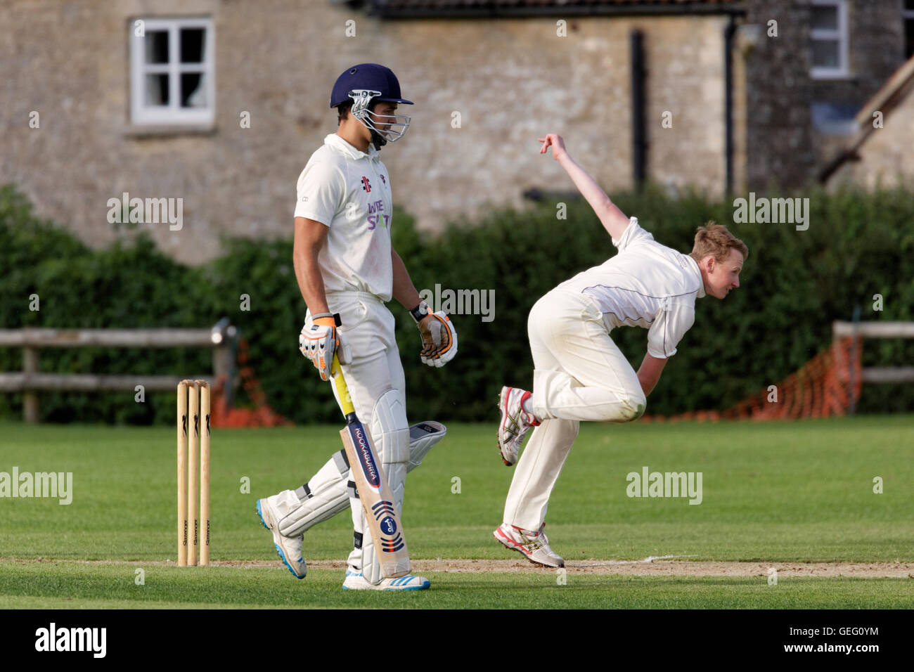 Village cricket match - a fast bowler is delivering the ball Stock ...