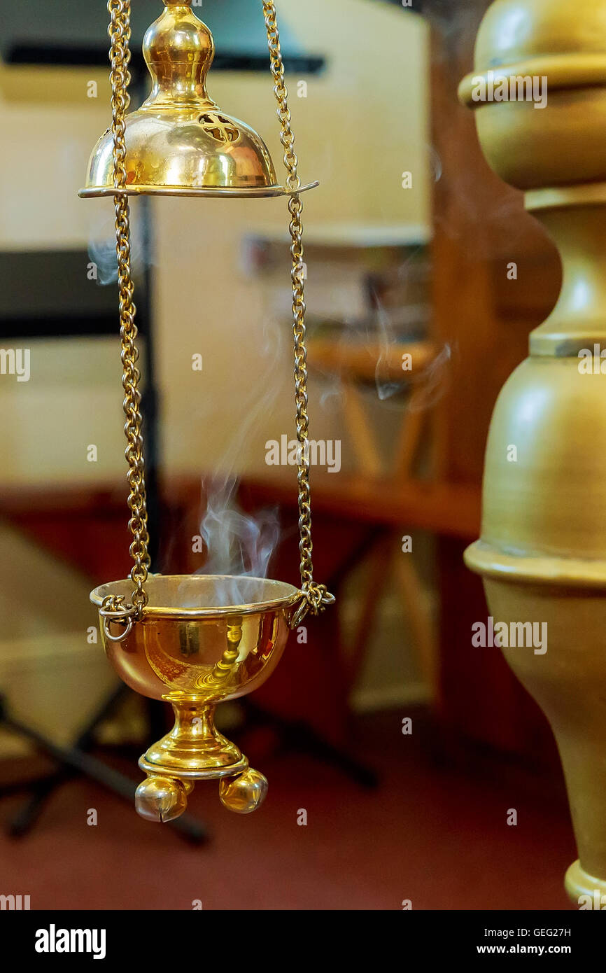 priest singing in a christian sermon censer church rite foog Stock ...