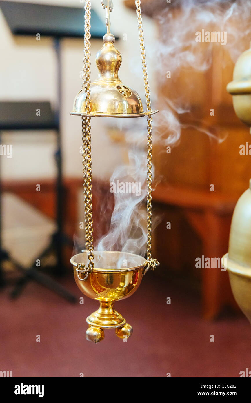 priest singing in a christian sermon censer church rite foog Stock ...