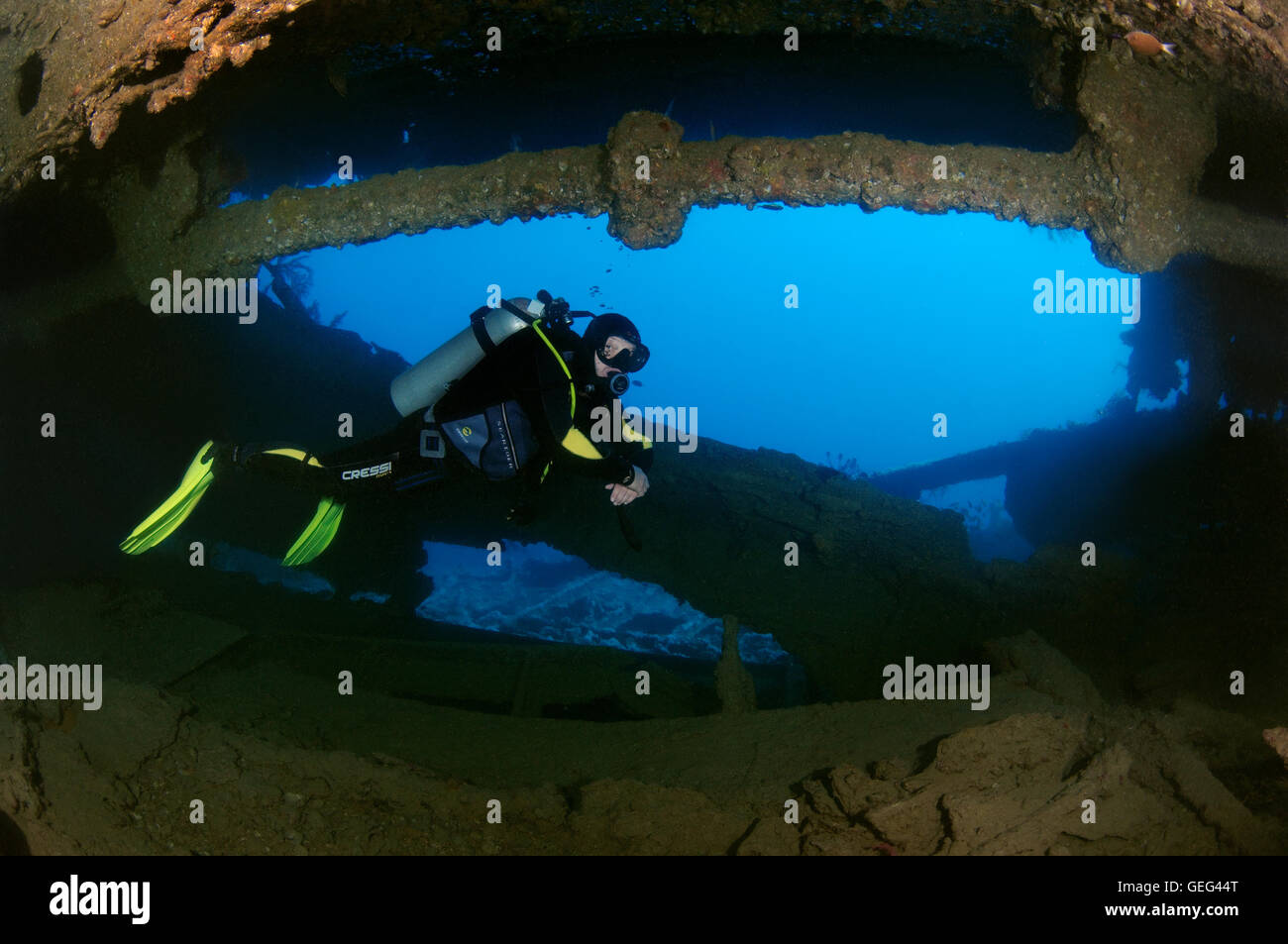 Male scuba diver inside the wreck of the SS Dunraven, Red Sea, Egypt ...