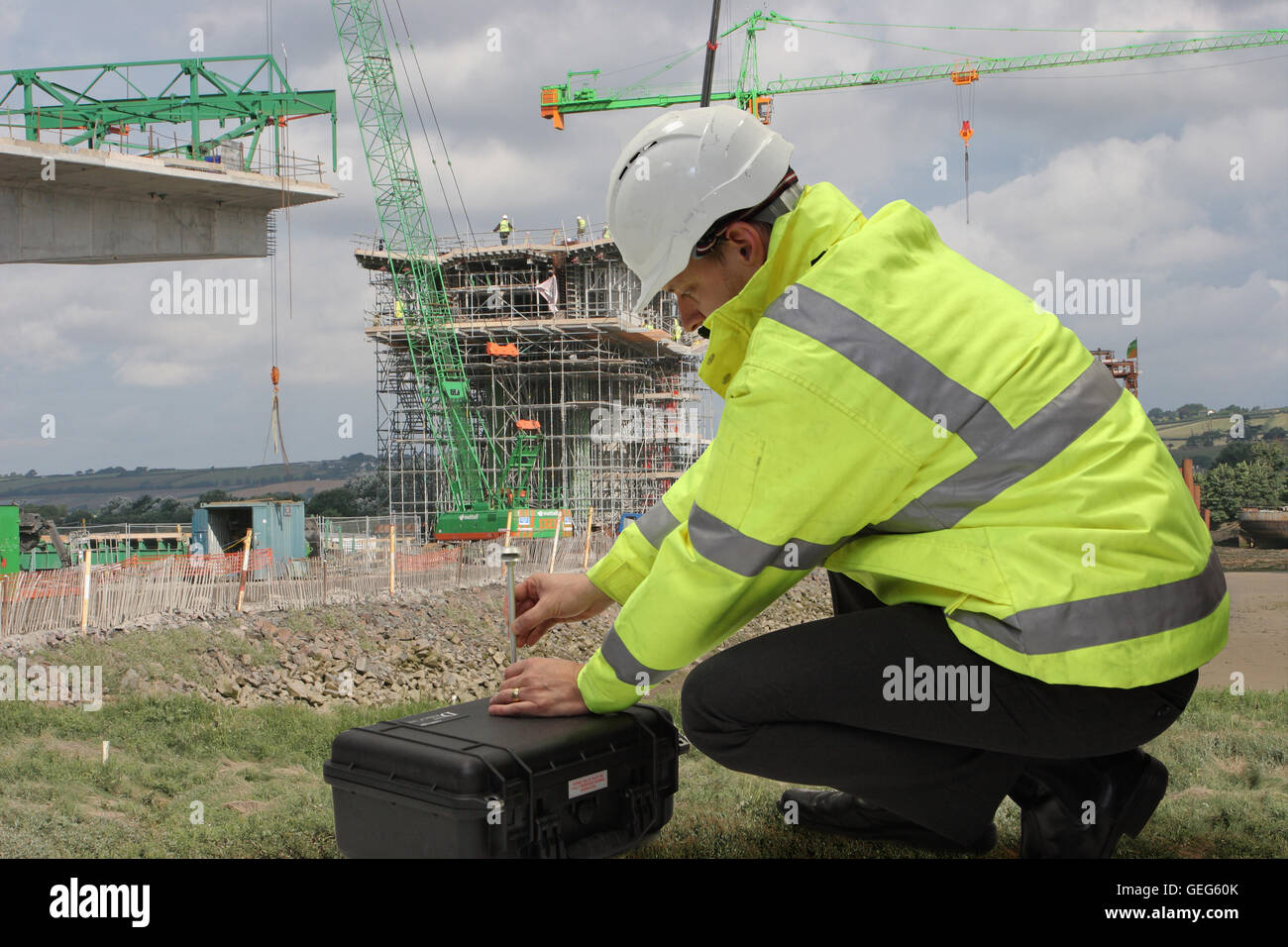 An environmental engineer installs a self-contained dust monitor ...