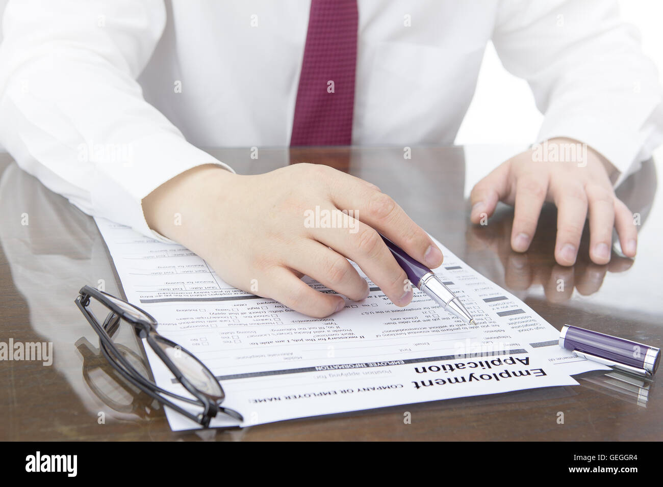 Businessman fill in Employment Application form with pen. job vacancy ...