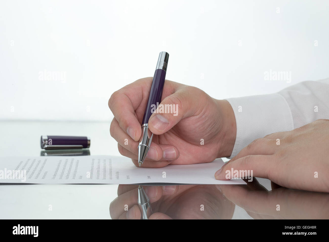 Hand with pen over application form, Businessman signing a contract ...
