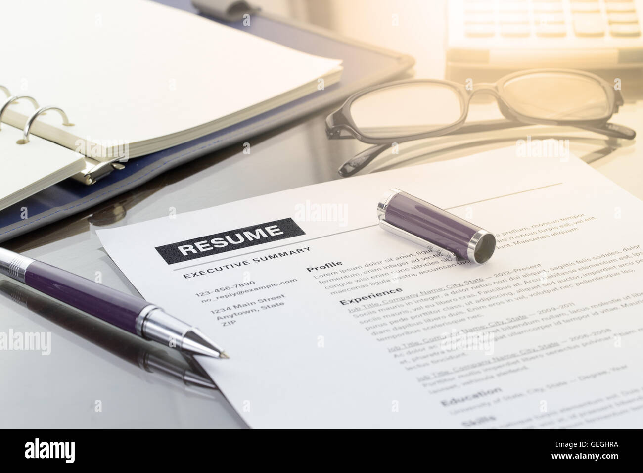 Resume information, pen, digital tablet, notebook, and glasses Stock ...