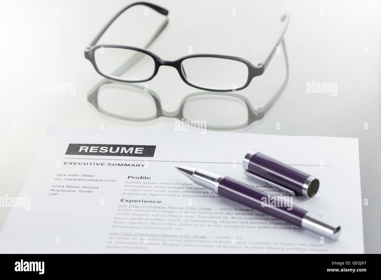 Resume information, pen, pencil and glasses Stock Photo - Alamy