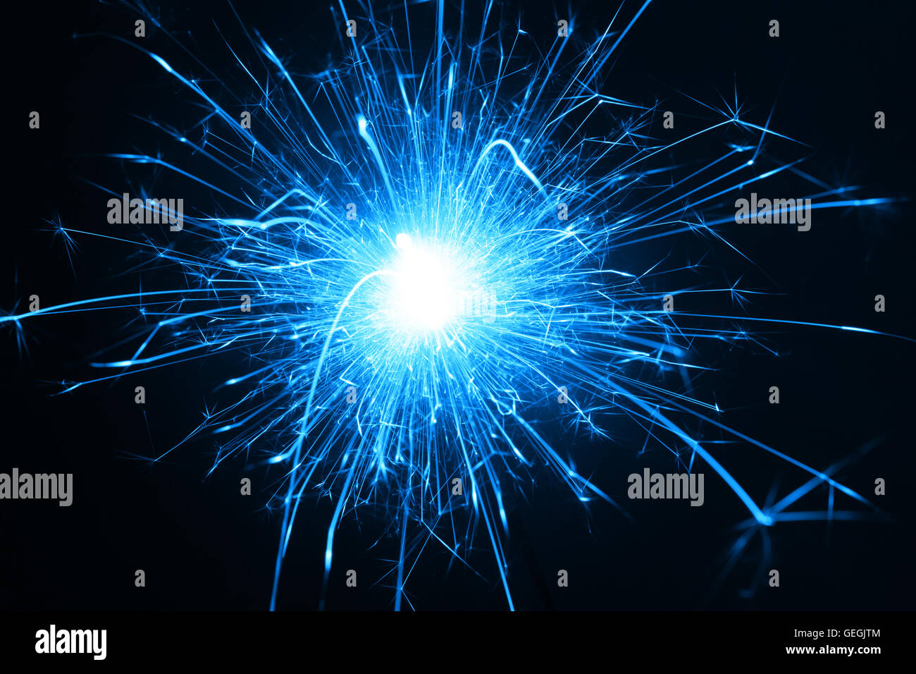 Blue burst of a sparkler in long exposure close up 2 Stock Photo - Alamy
