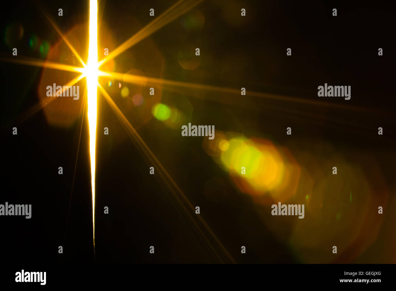 Real photographic lens flare of a bright light through a slit Stock ...