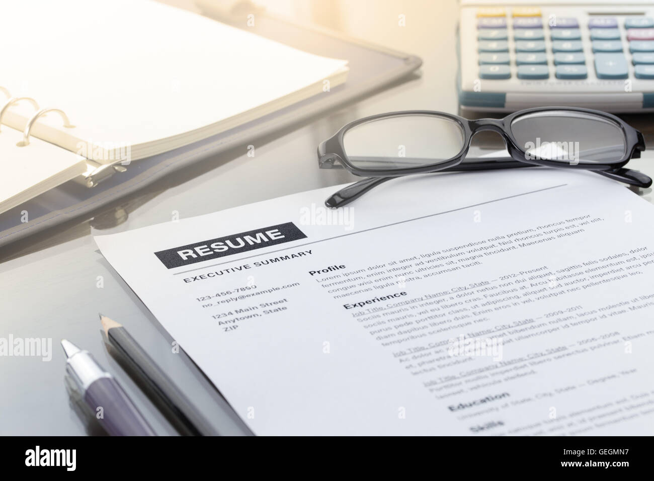 Resume information, pen, pencil, notebook, and glasses Stock Photo - Alamy