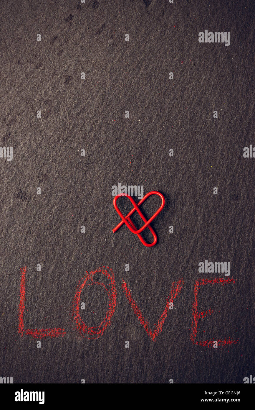Love concept for lovers made with heart-shaped clip. Vertical image ...