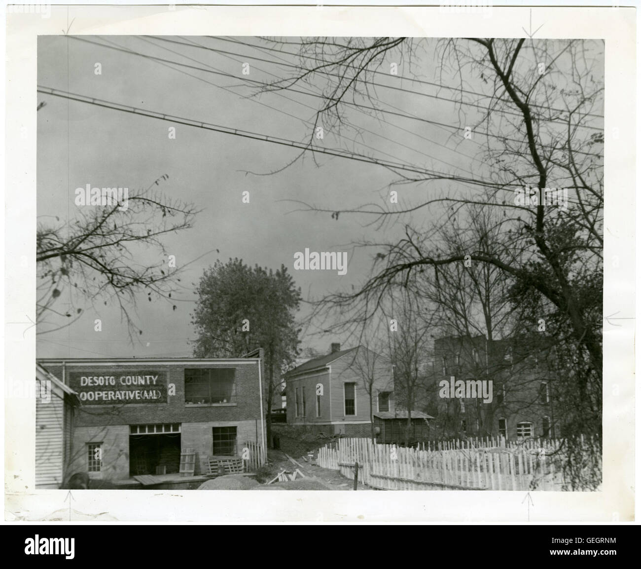 A historical photograph featuring a farmer from a cooperative (co-op ...