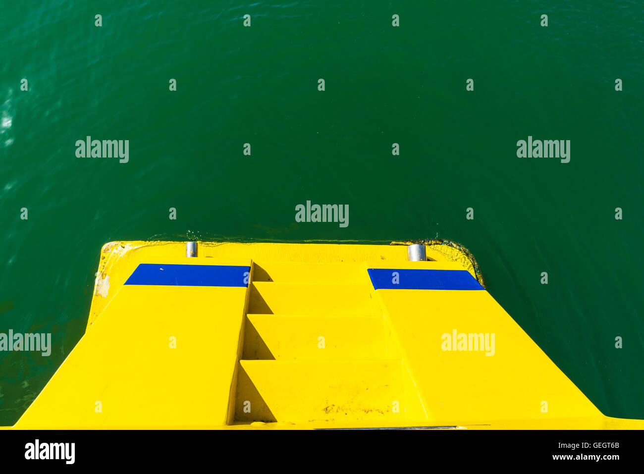 Yellow stern with stairs of a boat Stock Photo - Alamy