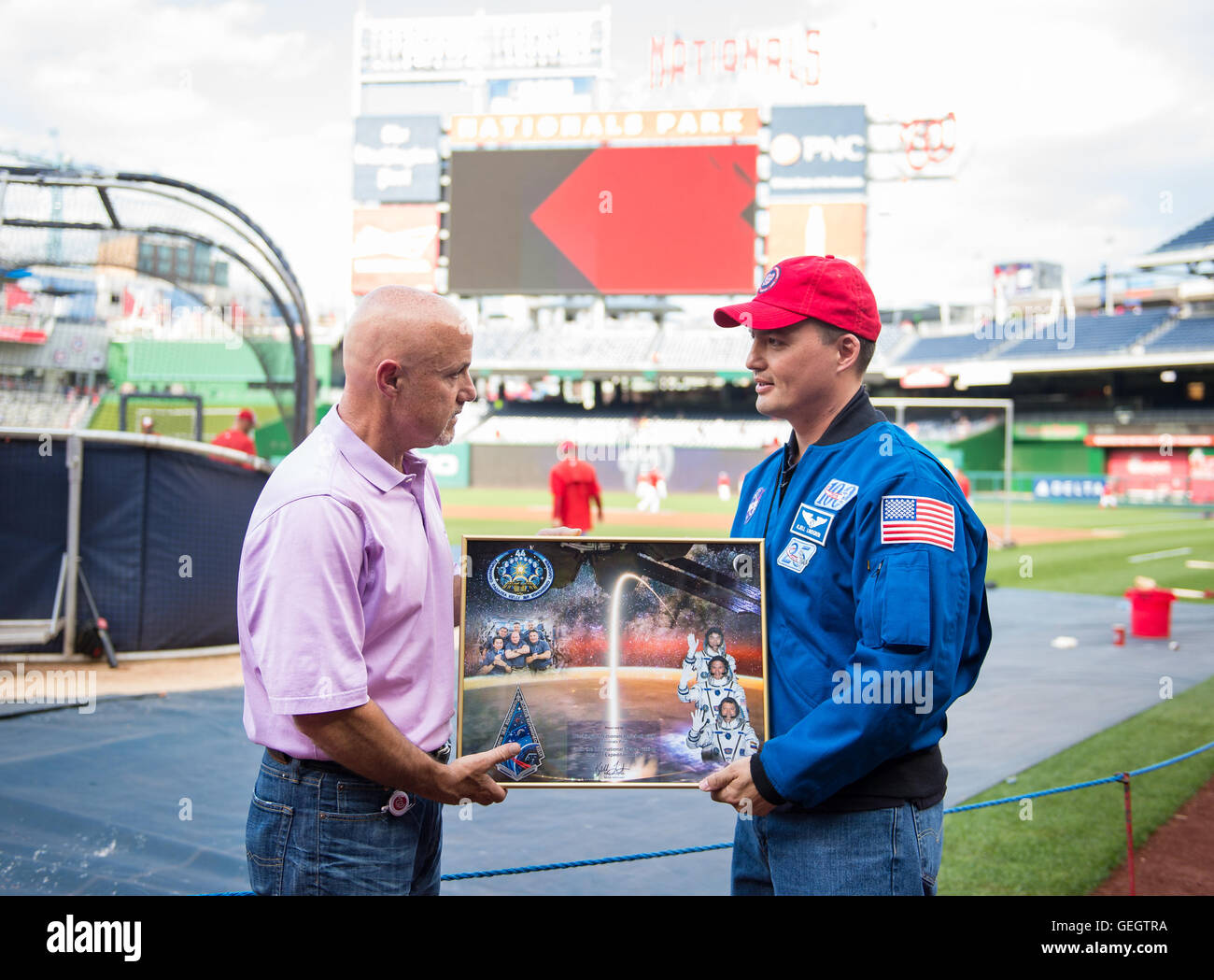 NASA astronaut Kjell Lindgren throws the first pitch at Nationals Park ...