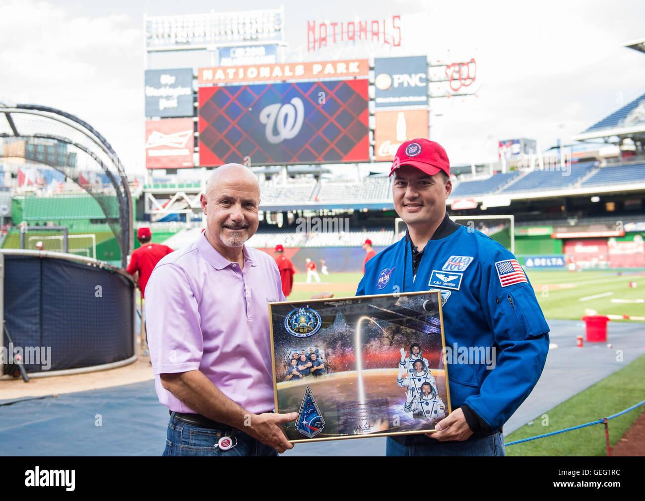 Astronaut Kjell Lindgren threw the ceremonial first pitch at a ...