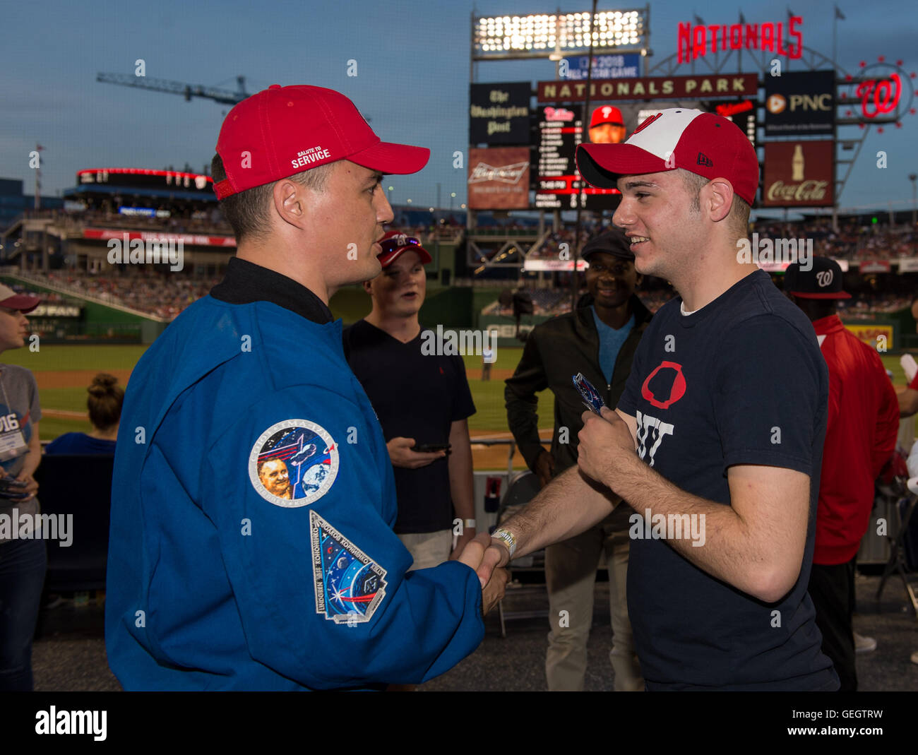 NASA astronaut Kjell Lindgren throws the first pitch at a Nationals ...