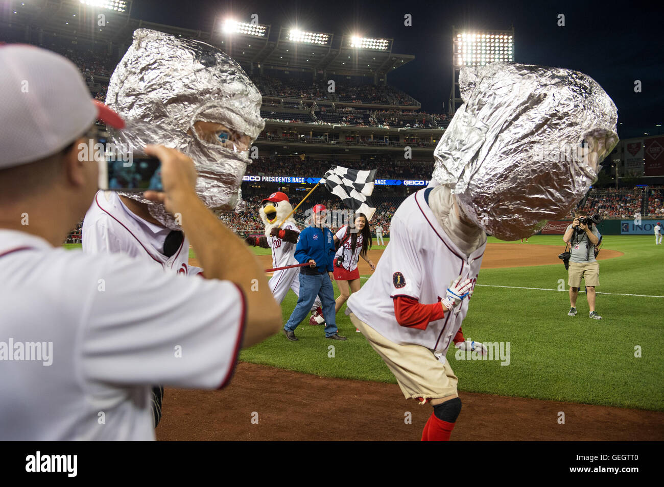 Astronaut Kjell Lindgren throws the first pitch at a Washington ...