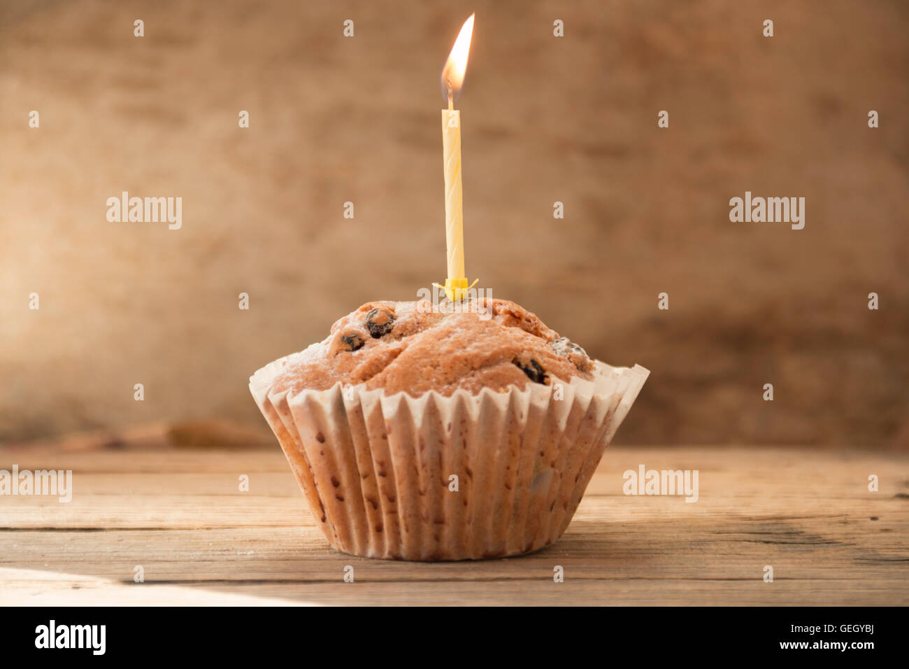 Birthday cupcake with candle Stock Photo - Alamy