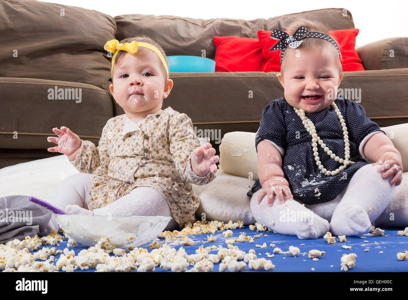messy food feeding babies popcorn and yogurt Stock Photo - Alamy