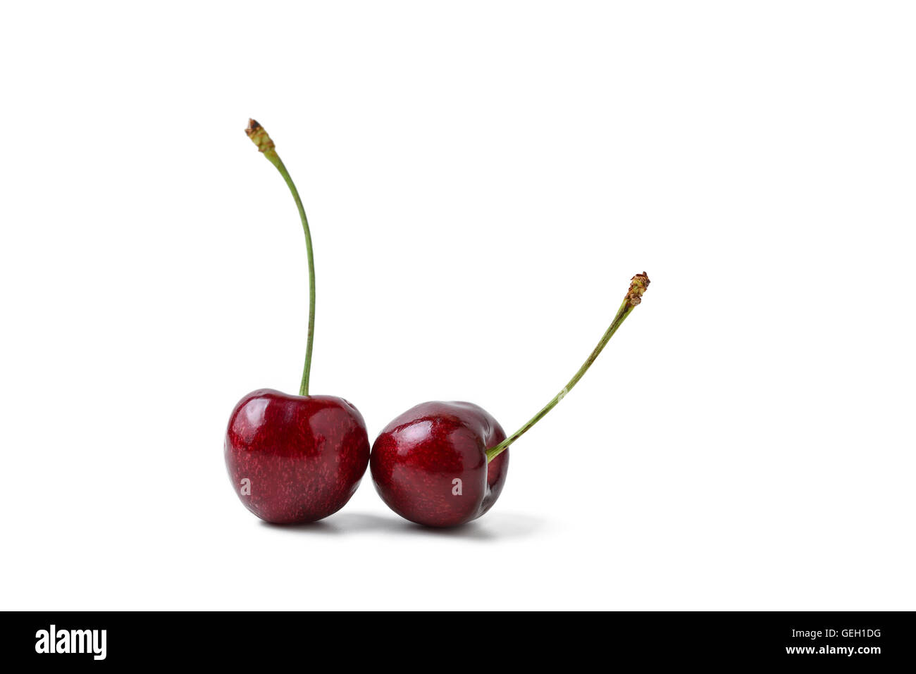 red cherry isolated on white Stock Photo - Alamy