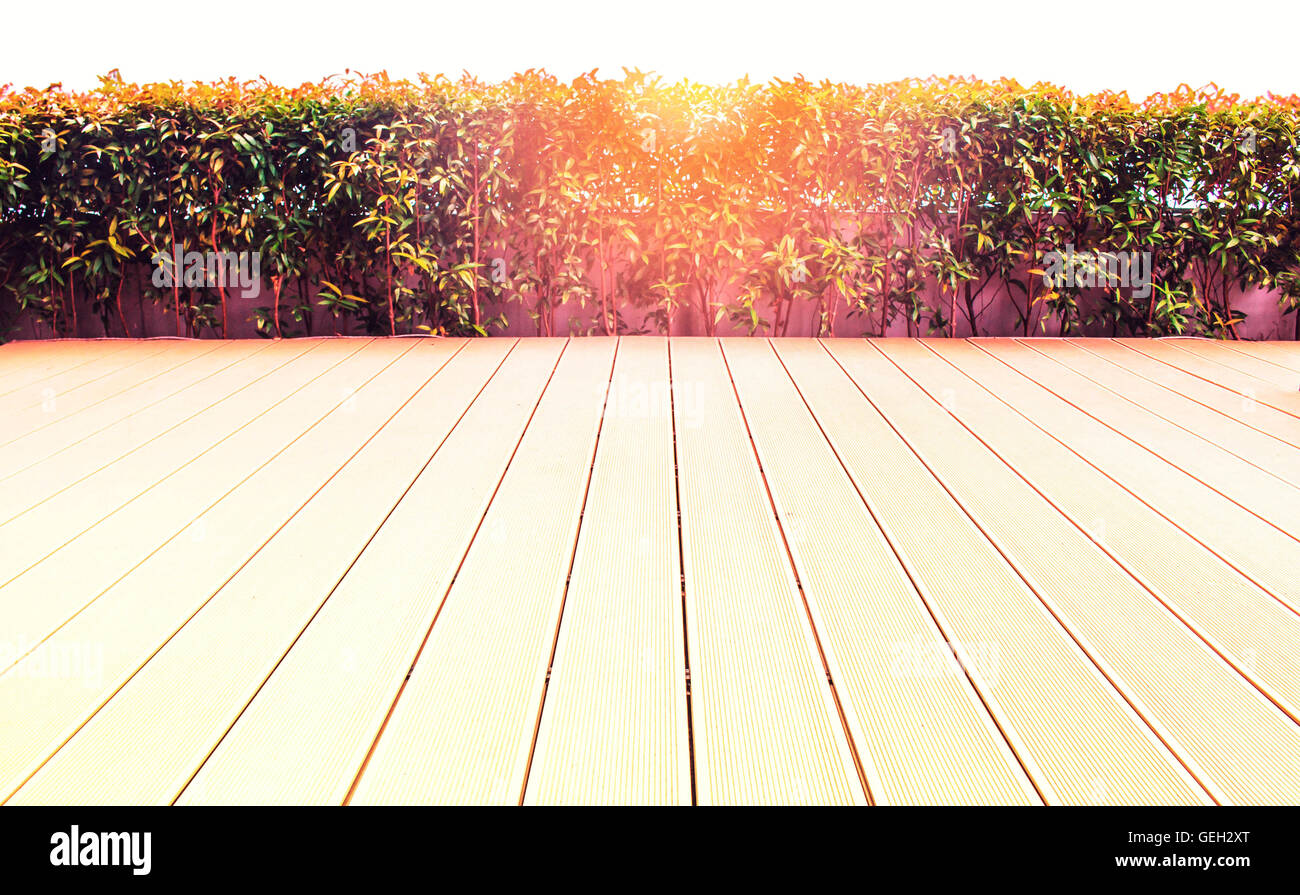 Wooden floors with ornamental trees in the garden Stock Photo - Alamy