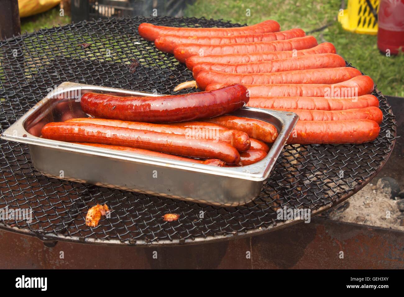 Grilling sausages on barbecue grill Stock Photo - Alamy