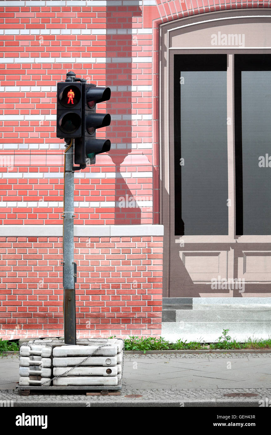 Traffic light behind a temporary brick wall painted canvas Stock Photo ...
