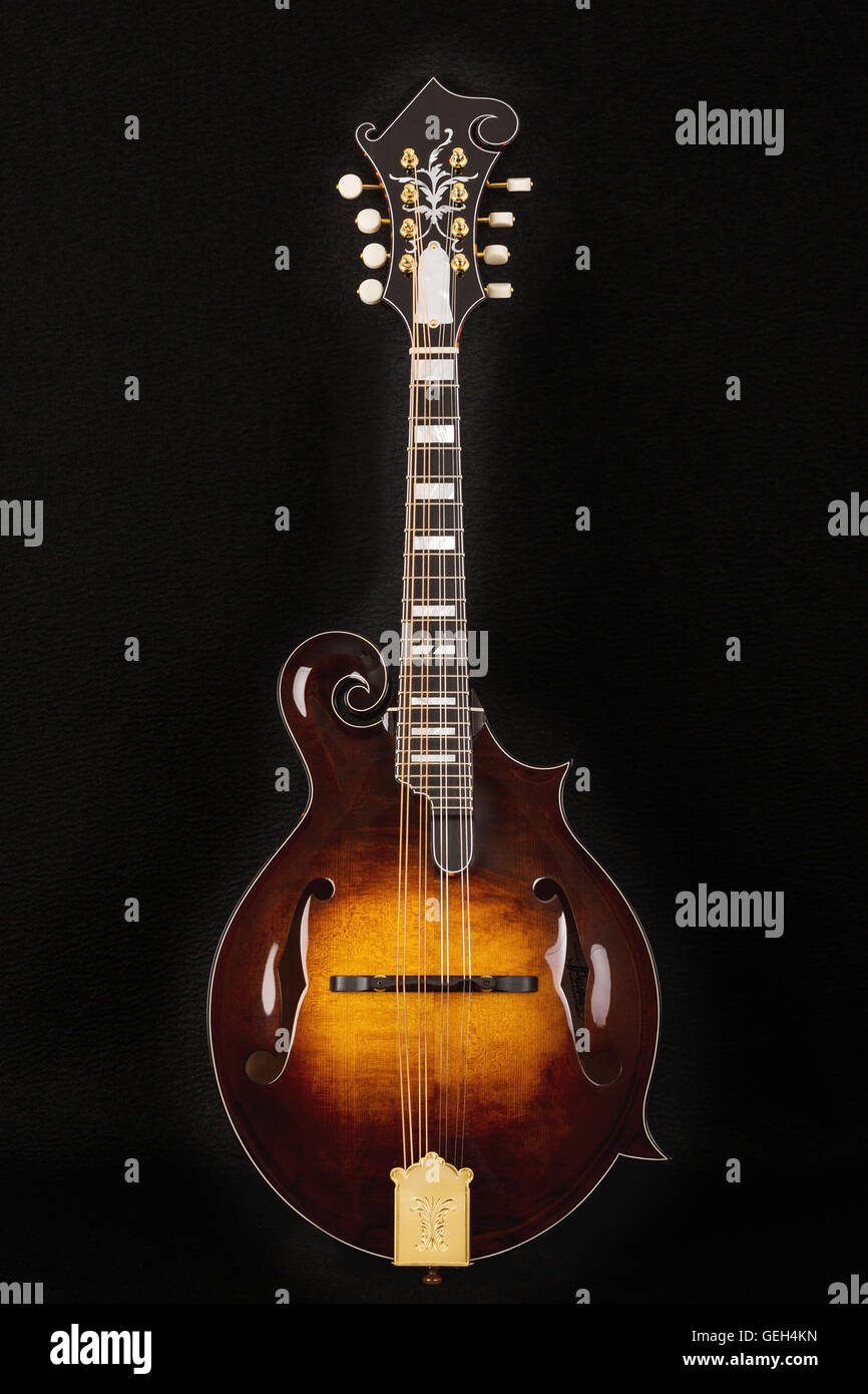 Mandolin isolated on black background Stock Photo - Alamy