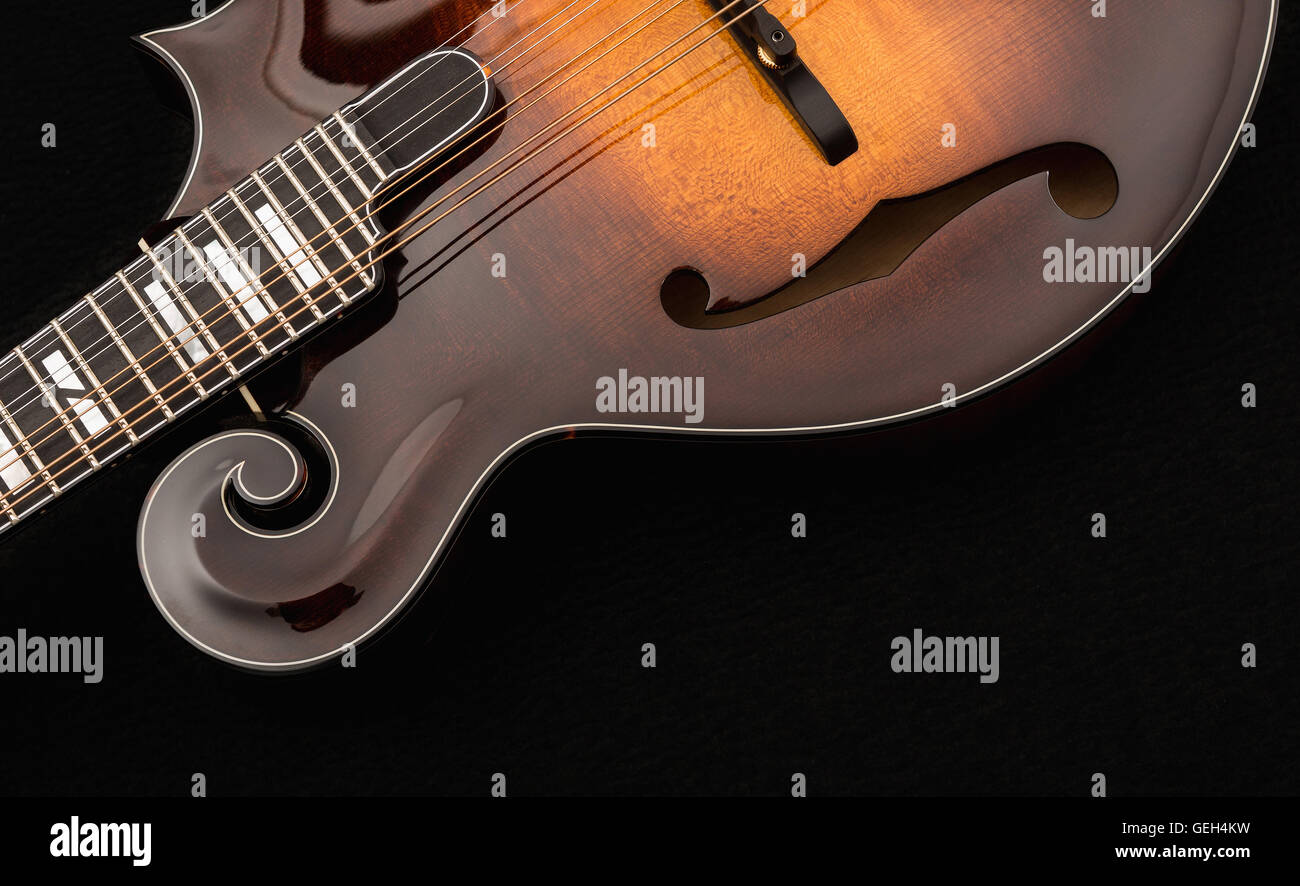 Mandolin isolated on black background Stock Photo - Alamy