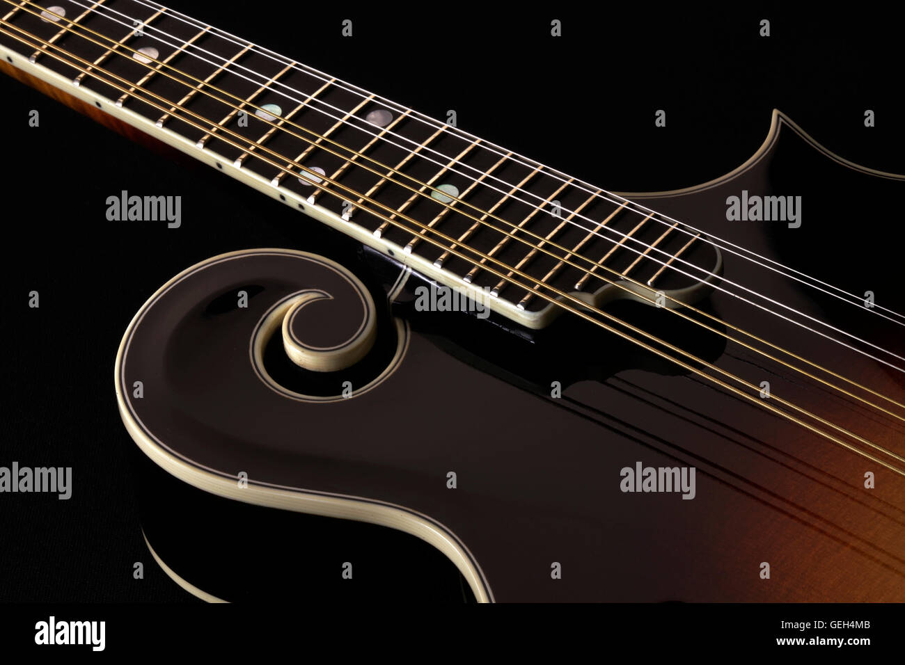 Mandolin isolated on black background Stock Photo - Alamy