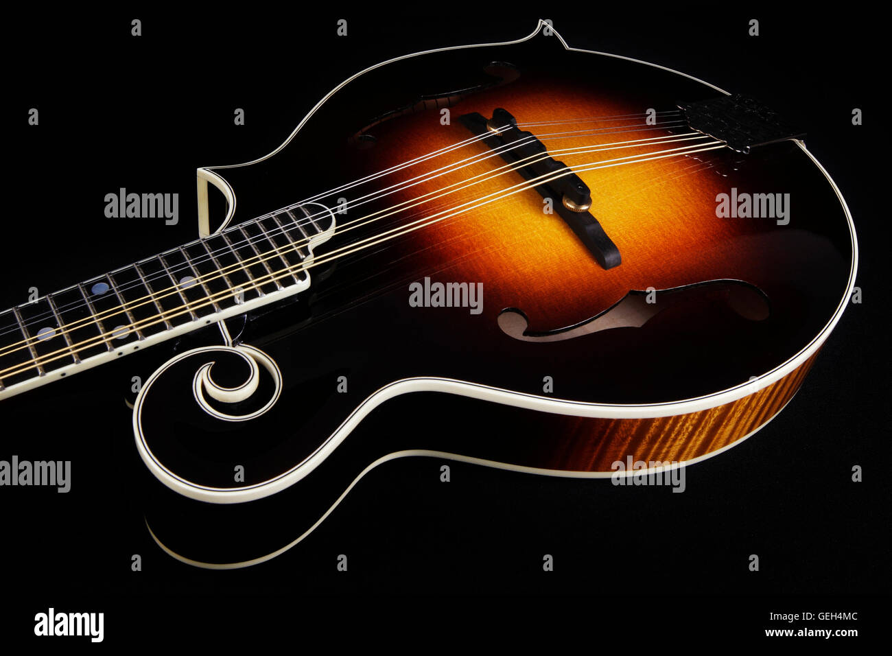 Mandolin isolated on black background Stock Photo - Alamy