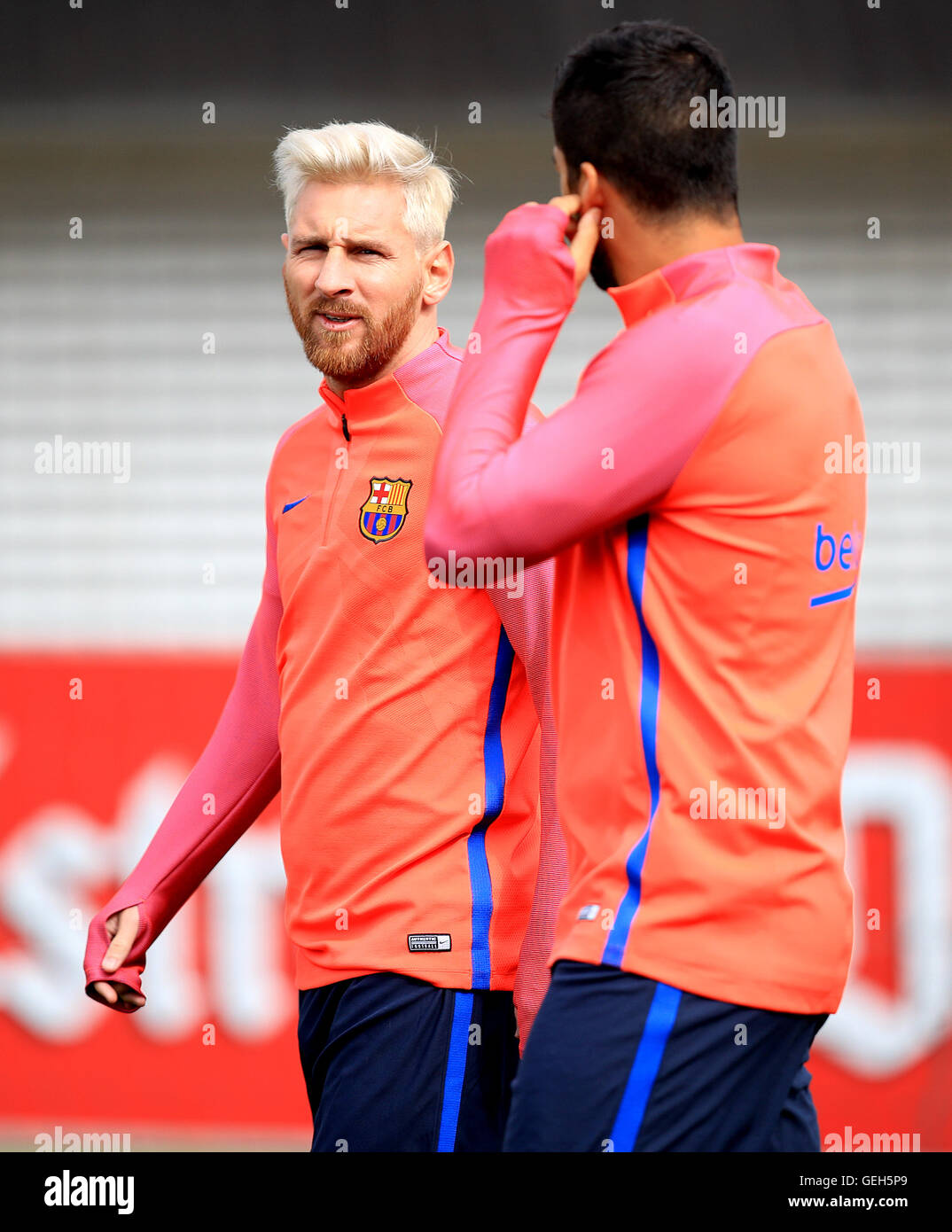Barcelona's Lionel Messi (left) during the training session at St ...
