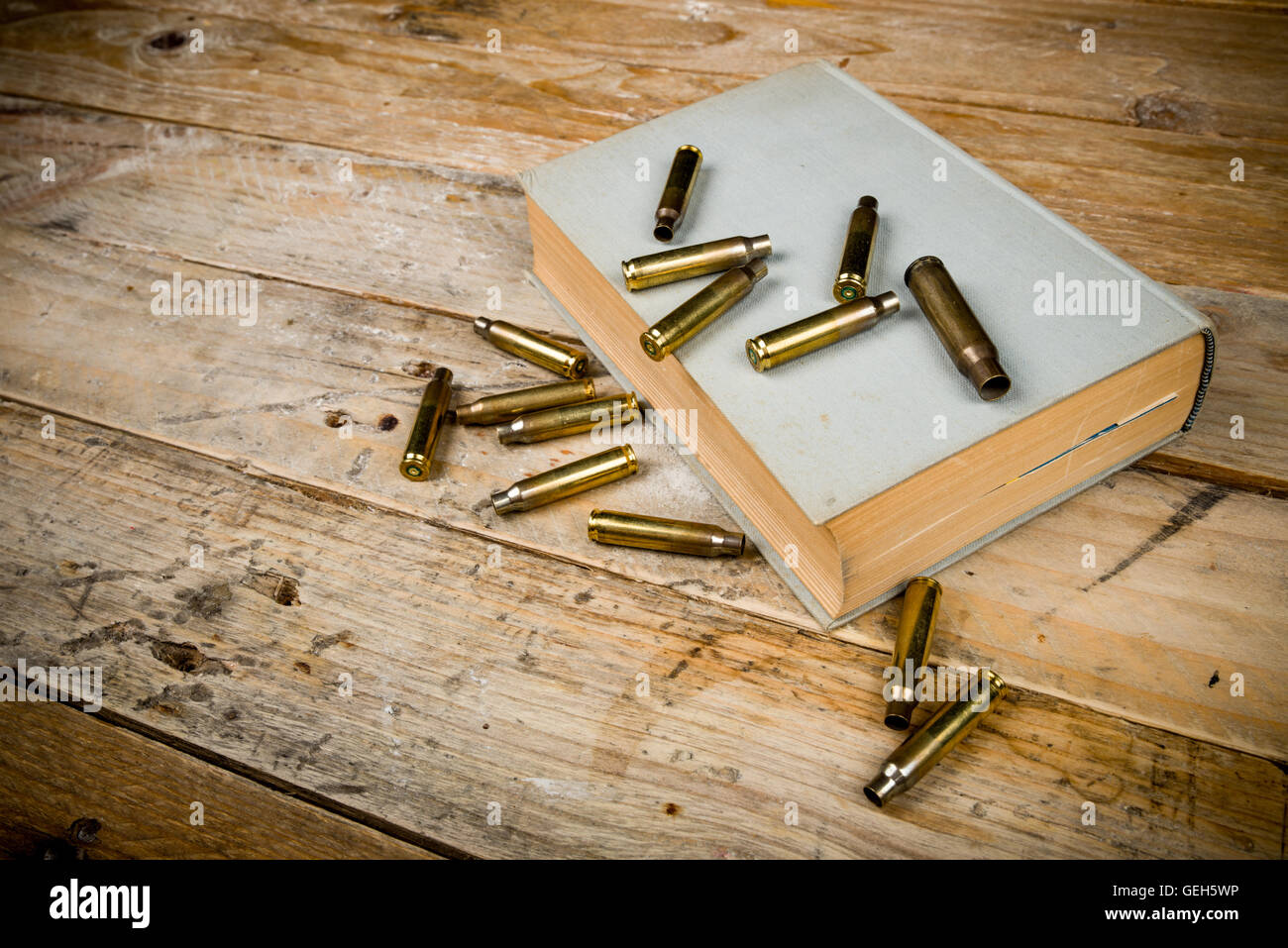 Still life with old book and bullets, a mystery novel concept Stock ...