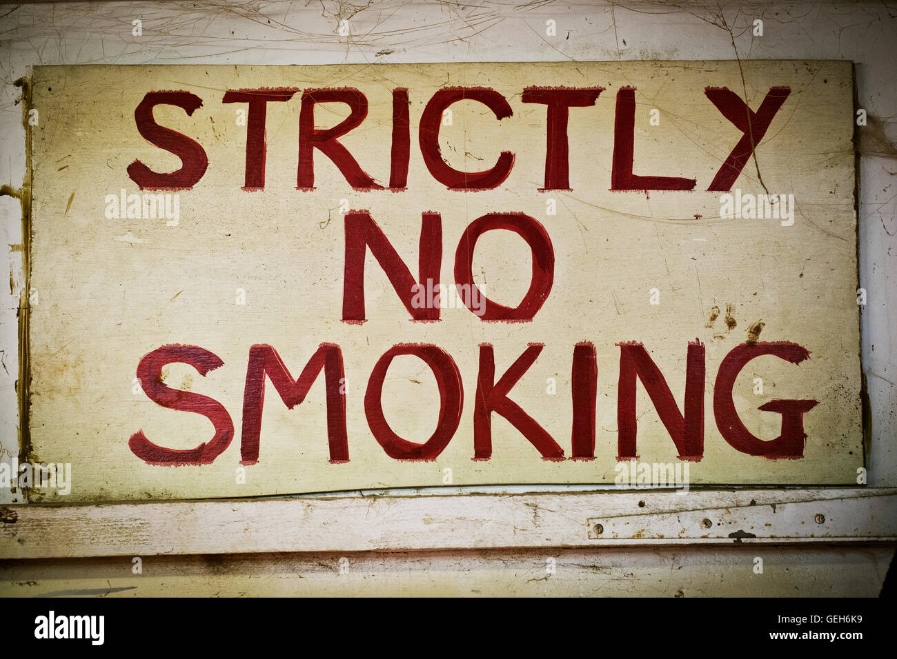 A sign saying Strictly No Smoking on the wall of a furniture maker's ...